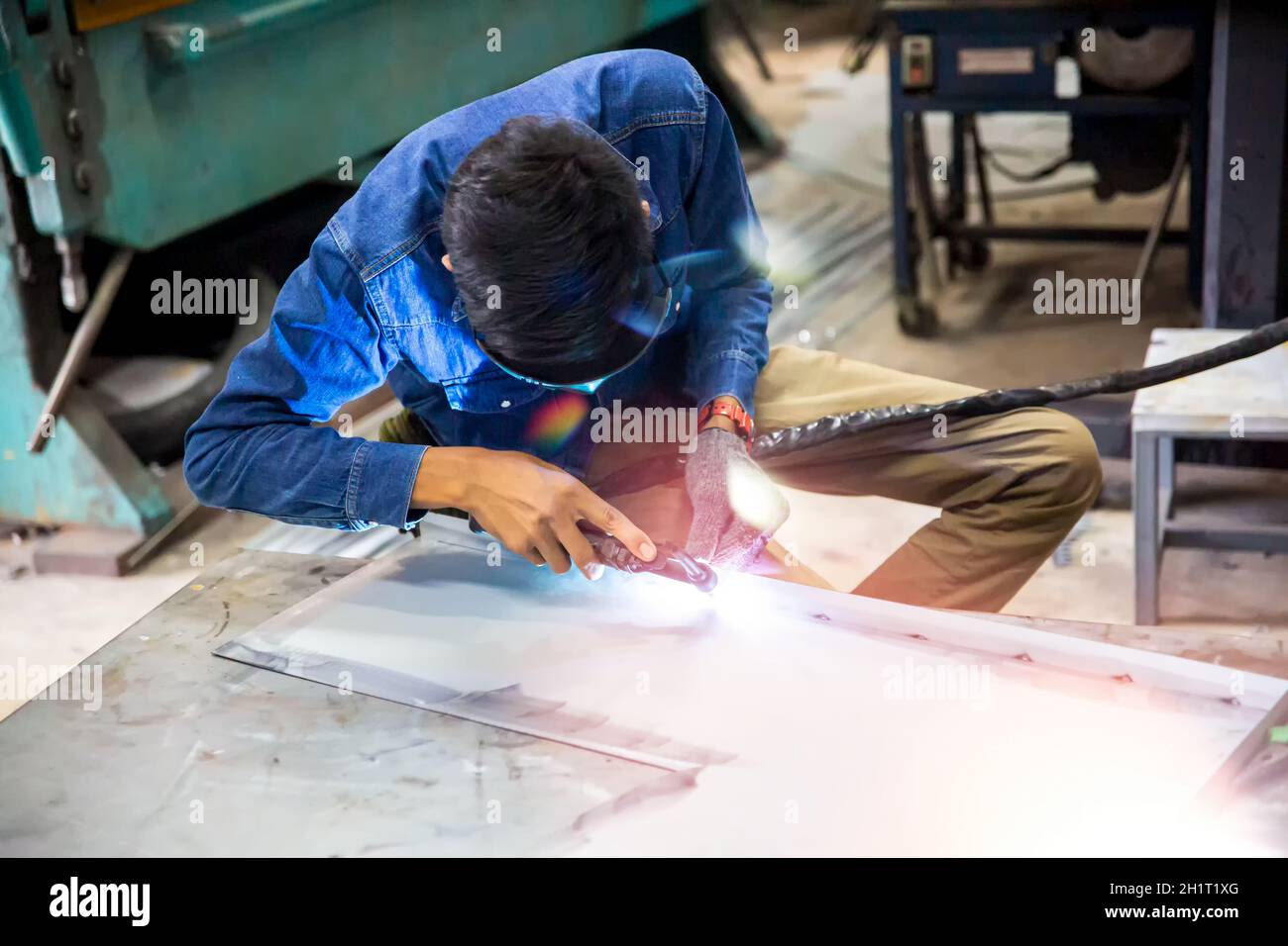 Welder used grinding stone on steel in factory with sparks, Welding ...