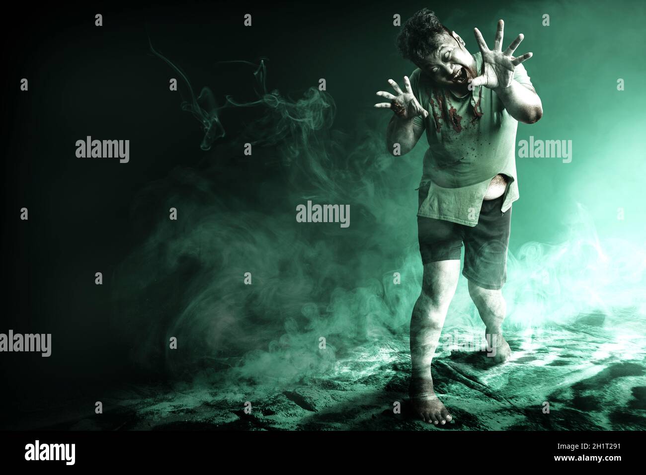 Scary zombie with blood and wound on his body walking on dark ...