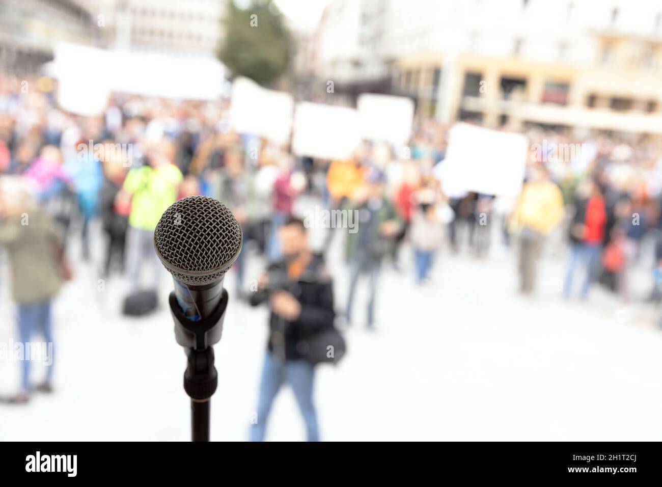 Public demonstration or political protest. Microphone in focus against ...