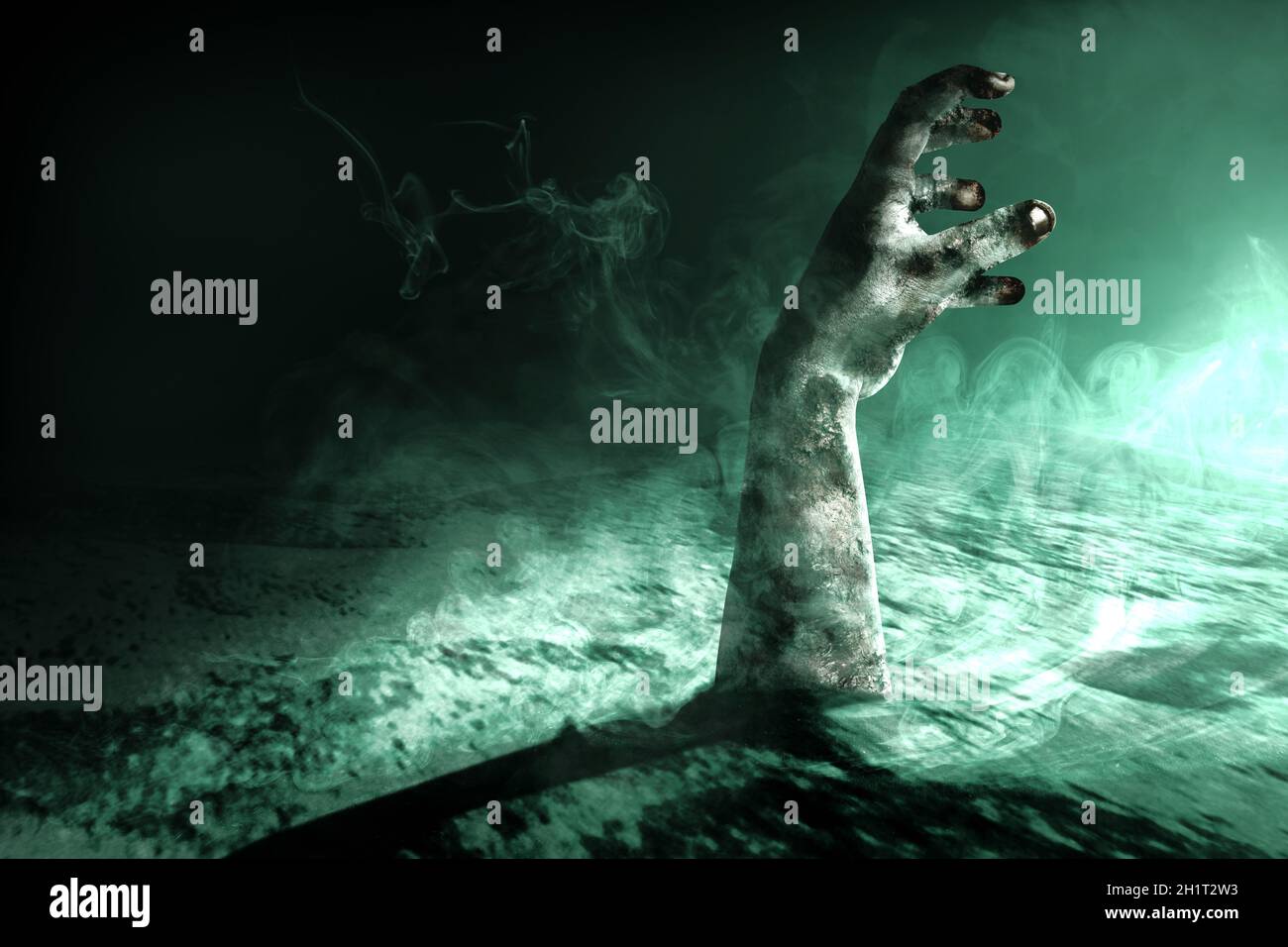 Zombie hand with blood and wound raised from the ground Stock Photo - Alamy