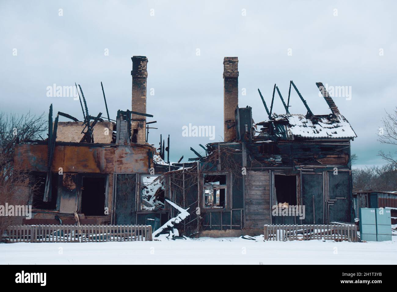 Burnt wooden house. House after the fire. House destroyed in a gas ...
