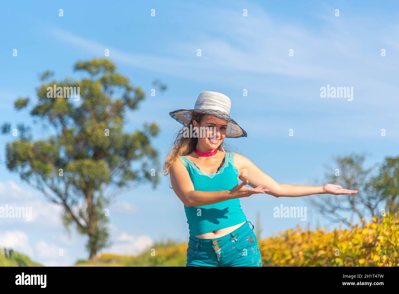 Brazilian woman dressed in blue showing a soybean plantation. Lifestyle ...