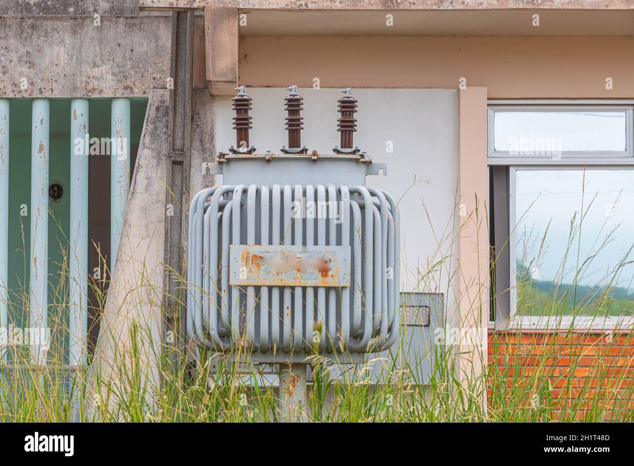 Electricity transformer in abandoned house. Energetic equipment ...