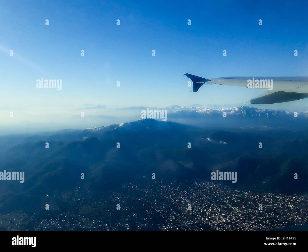 Window plane point aerial landscape of greece coast Stock Photo - Alamy
