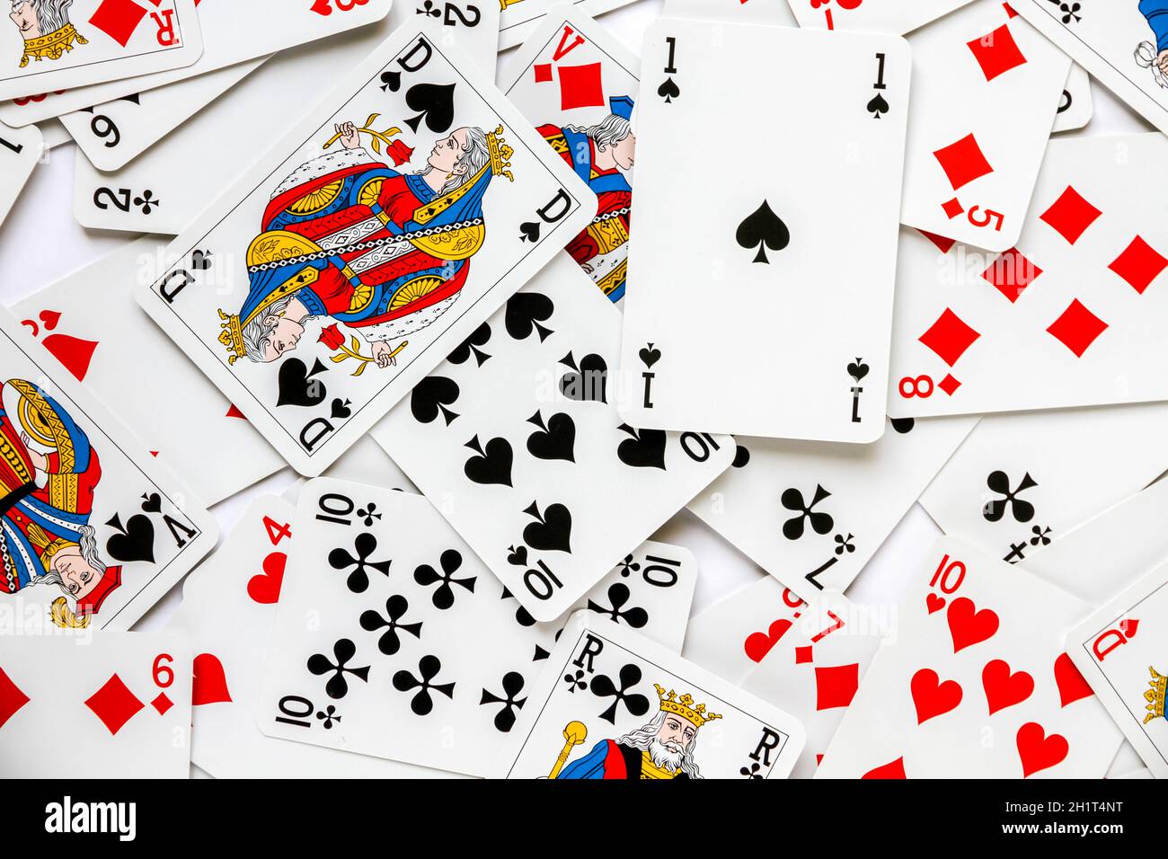Classic playing card game laid out on a table. White background Stock ...
