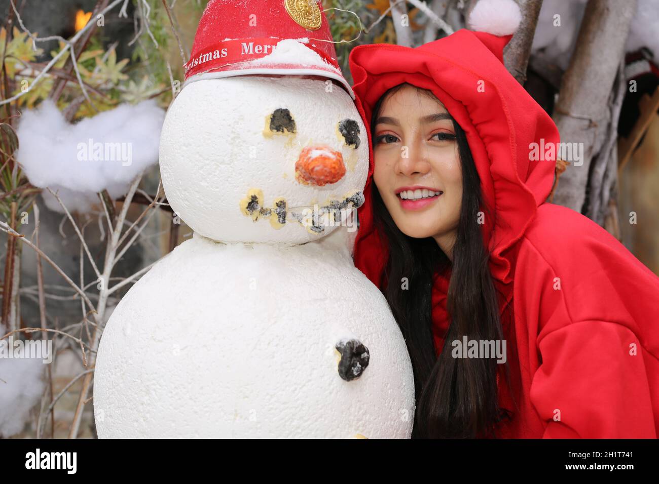 City winter woman happy standing excited and elated with arms raised in ...