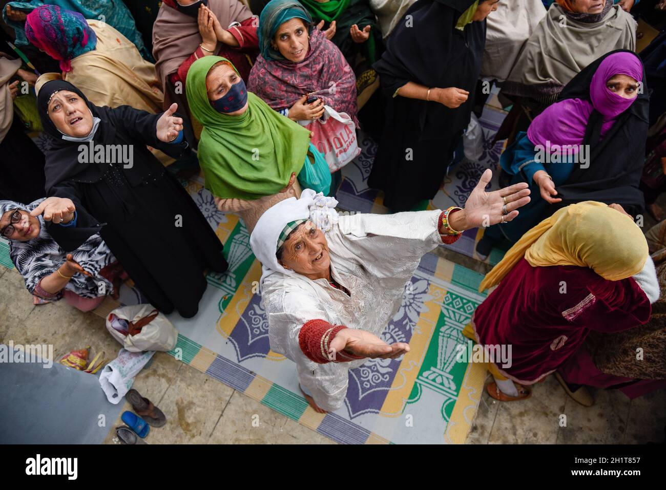 Srinagar, India. 19th Oct, 2021. Kashmiri Muslim devotees raise their ...