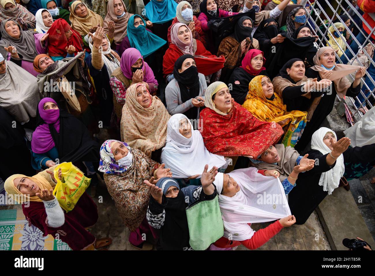 Srinagar, India. 19th Oct, 2021. Kashmiri Muslim devotees raise their ...