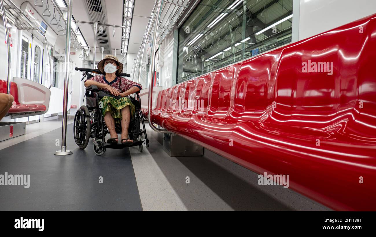 Senior Disabled person in wheelchair on traveling in train for ...