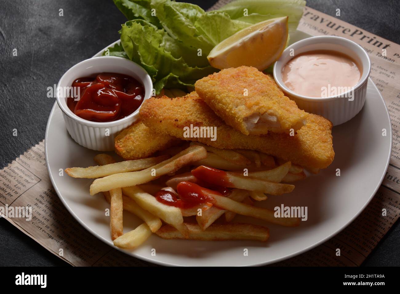 Traditional English Food - Fish and Chips. Fried fish filets and crispy ...