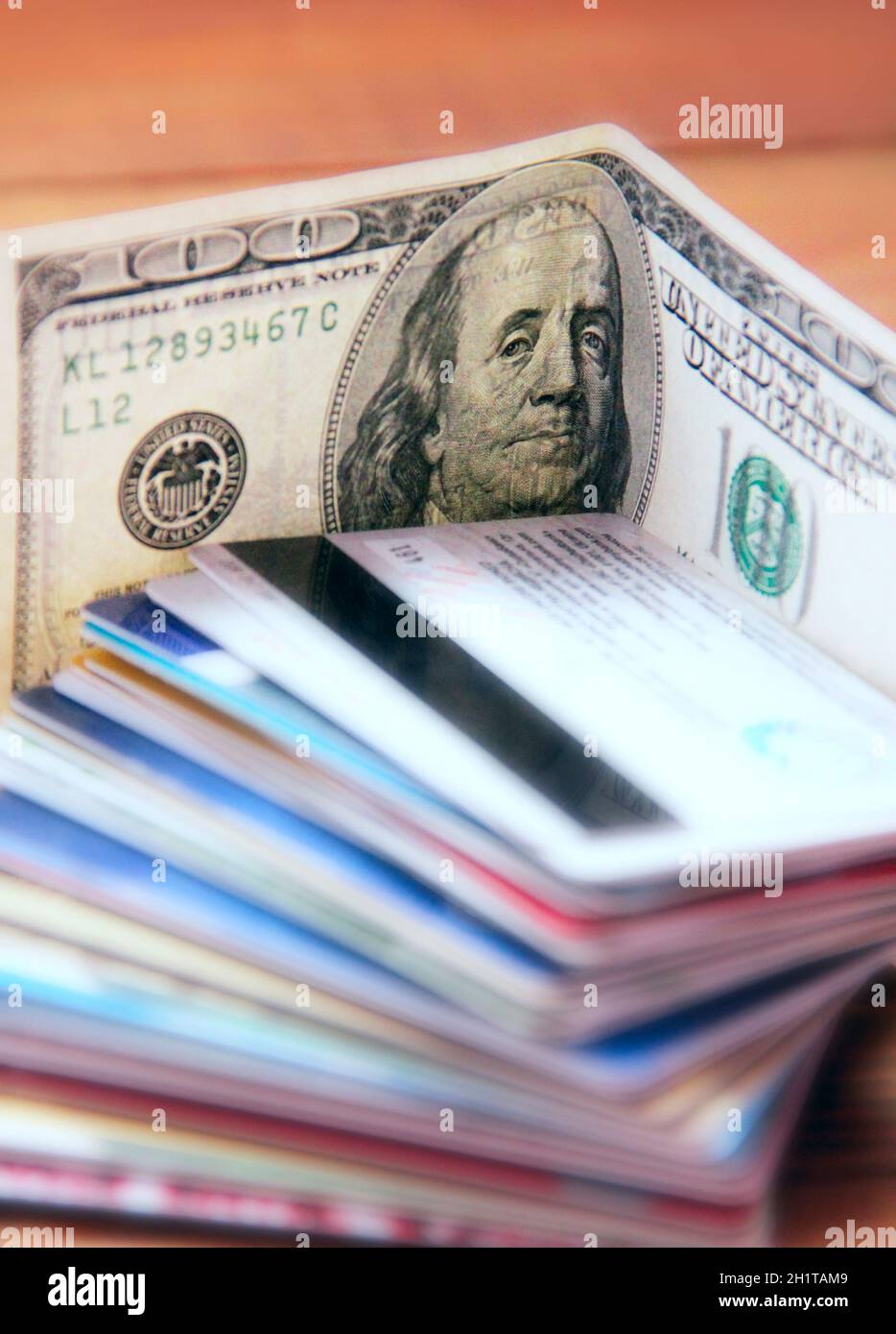 Hundred dollar note and credit cards. Pile of credit cards in dollars ...
