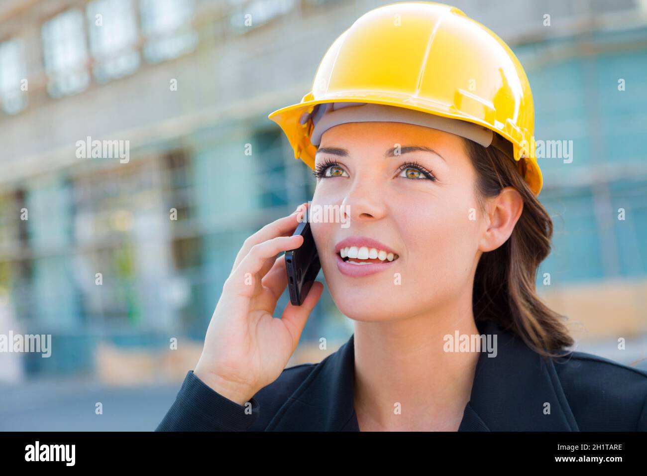 Young Professional Female Contractor Wearing Hard Hat at Contruction ...