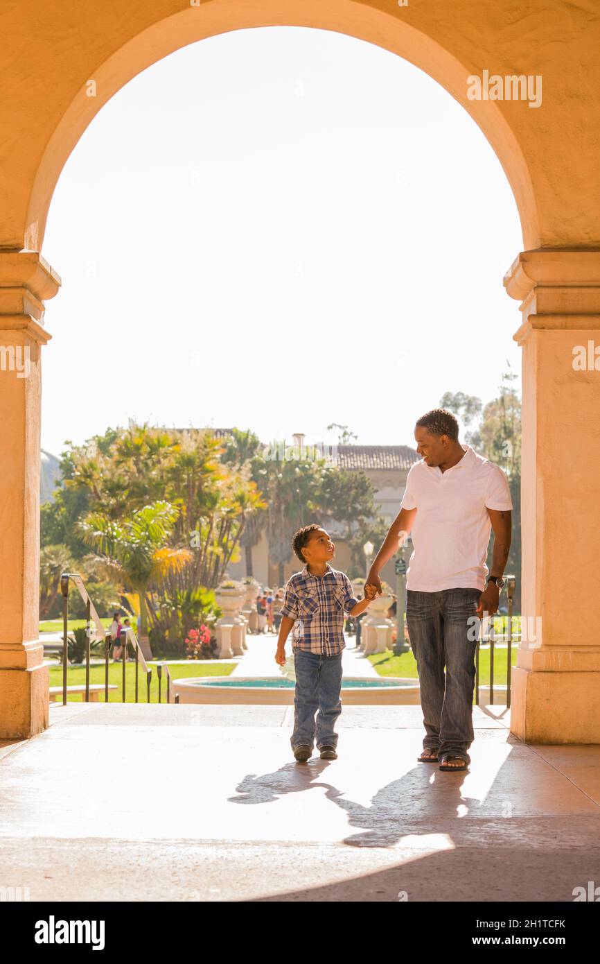 Happy African American Father and Mixed Race Son Holding Hands Walking ...