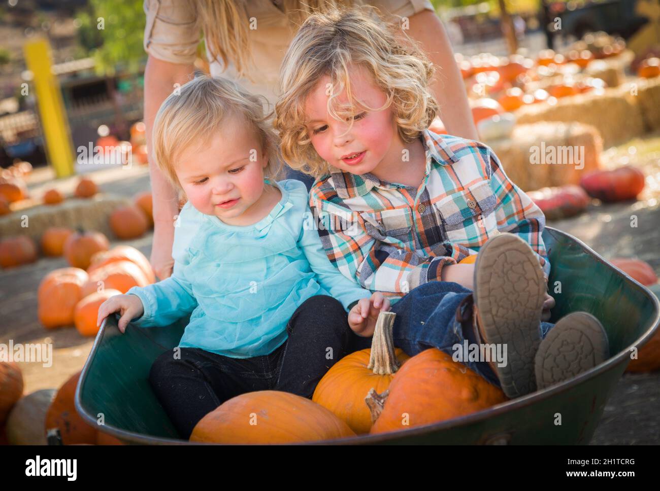 Adorable Young Family Enjoys a Day at the Pumpkin Patch Stock Photo - Alamy