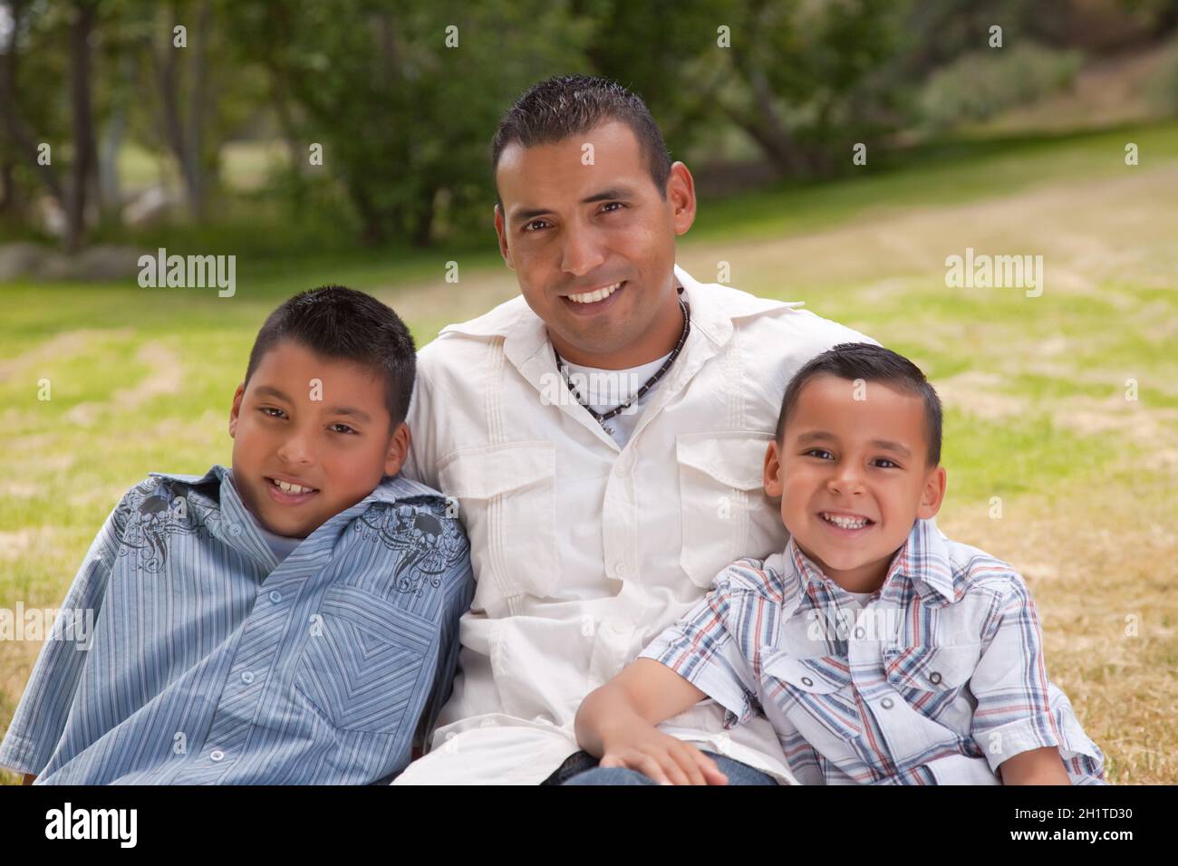 Hispanic Father and Sons Portrait in the Park Stock Photo - Alamy