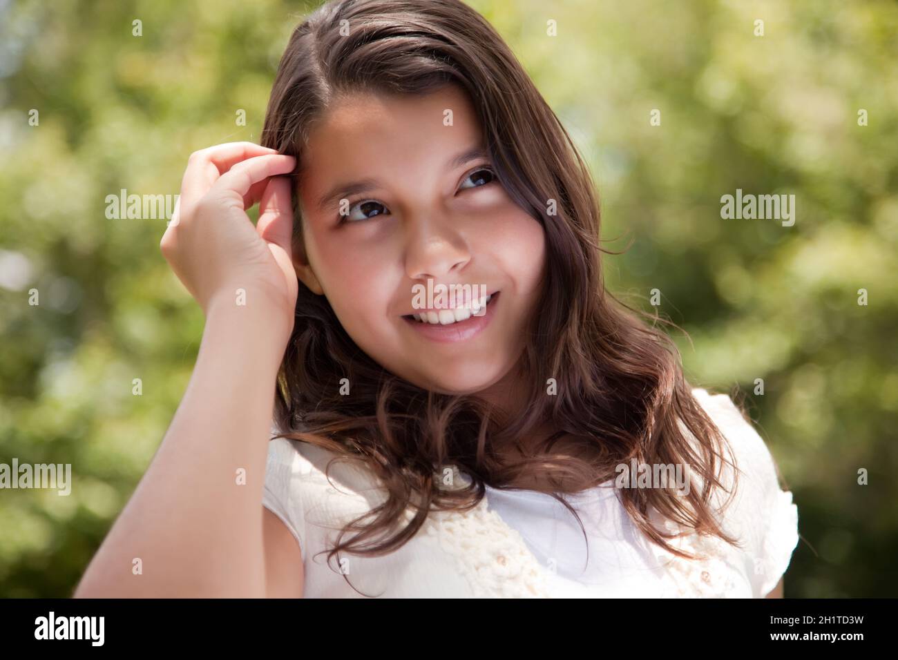 Cute Happy Hispanic Girl Portrait in the Park Stock Photo - Alamy