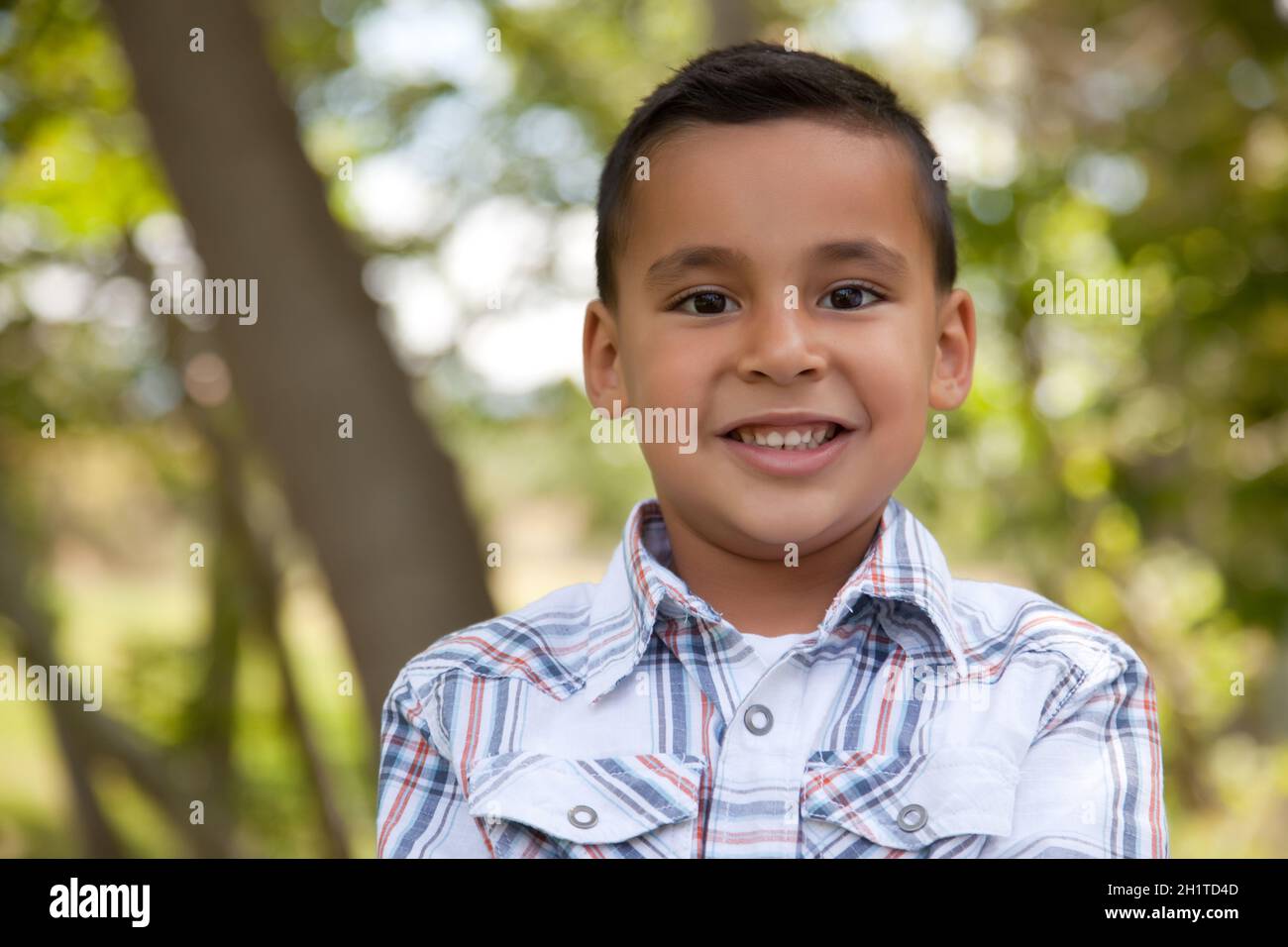Handsome Young Hispanic Boy Having Fun in the Park Stock Photo - Alamy