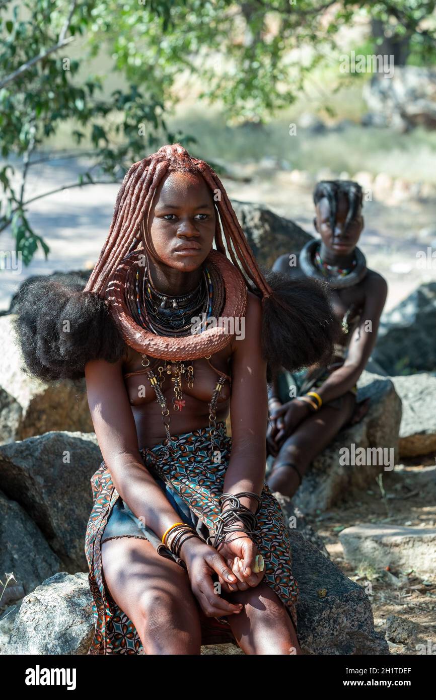 NAMIBIA, OMUSATI REGION, MAY 7: Portrait of Himba woman with traditional hairstyle and necklaces ...
