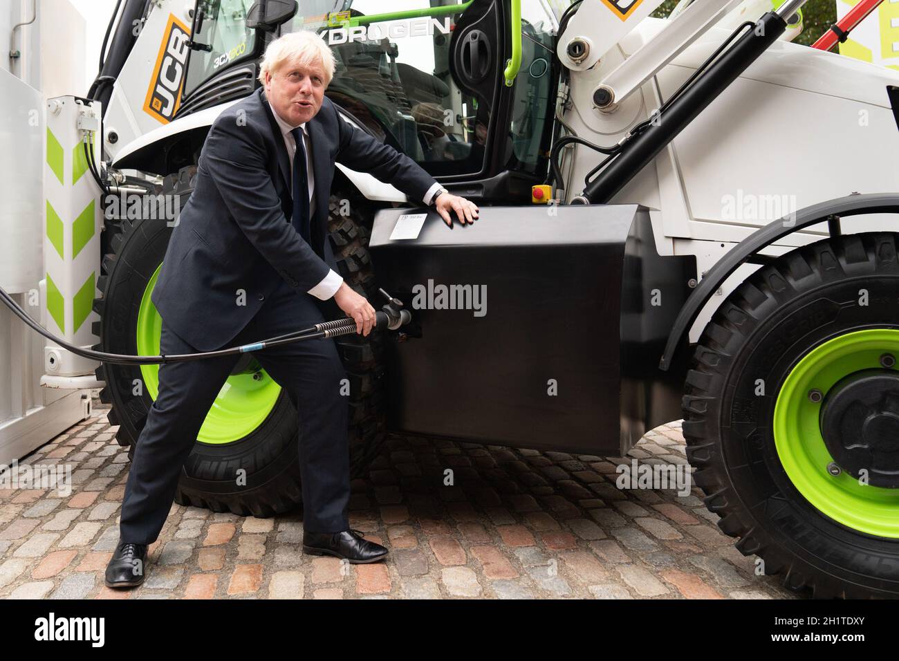 Prime Minister Boris Johnson unveils a hydrogen powered JCB Loadall ...