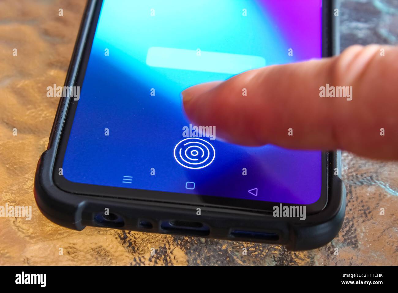 Hand holding modern mobile phone showing application with process of ...