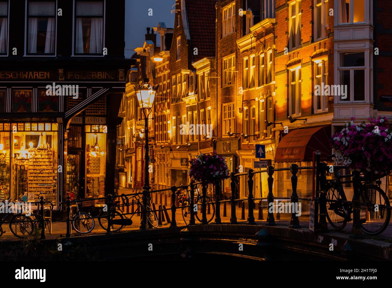 Beautiful view of European street with orange lighting and classic ...