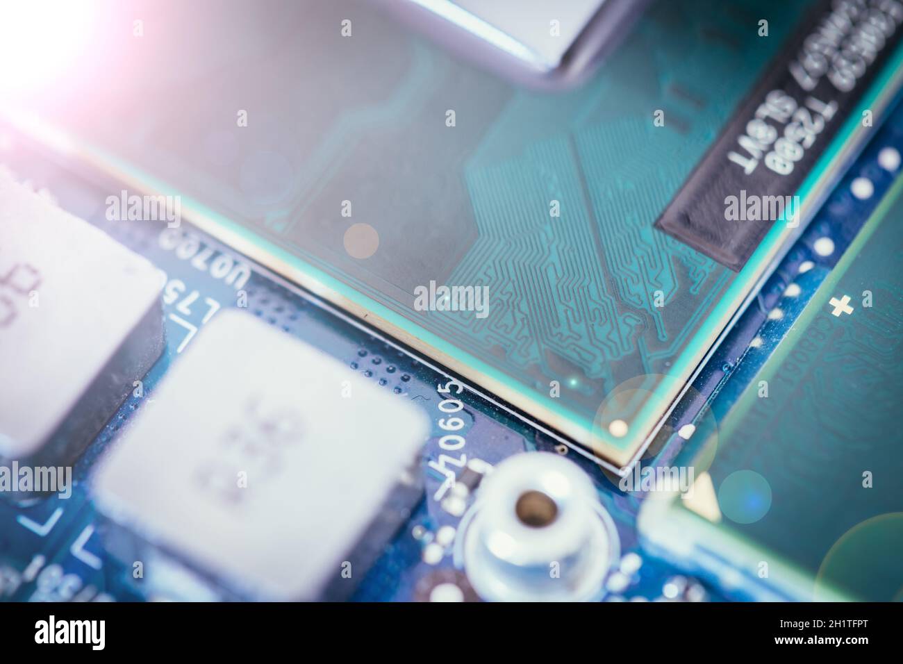 Computer chip on a circuit board, close up with light effect. Computer ...