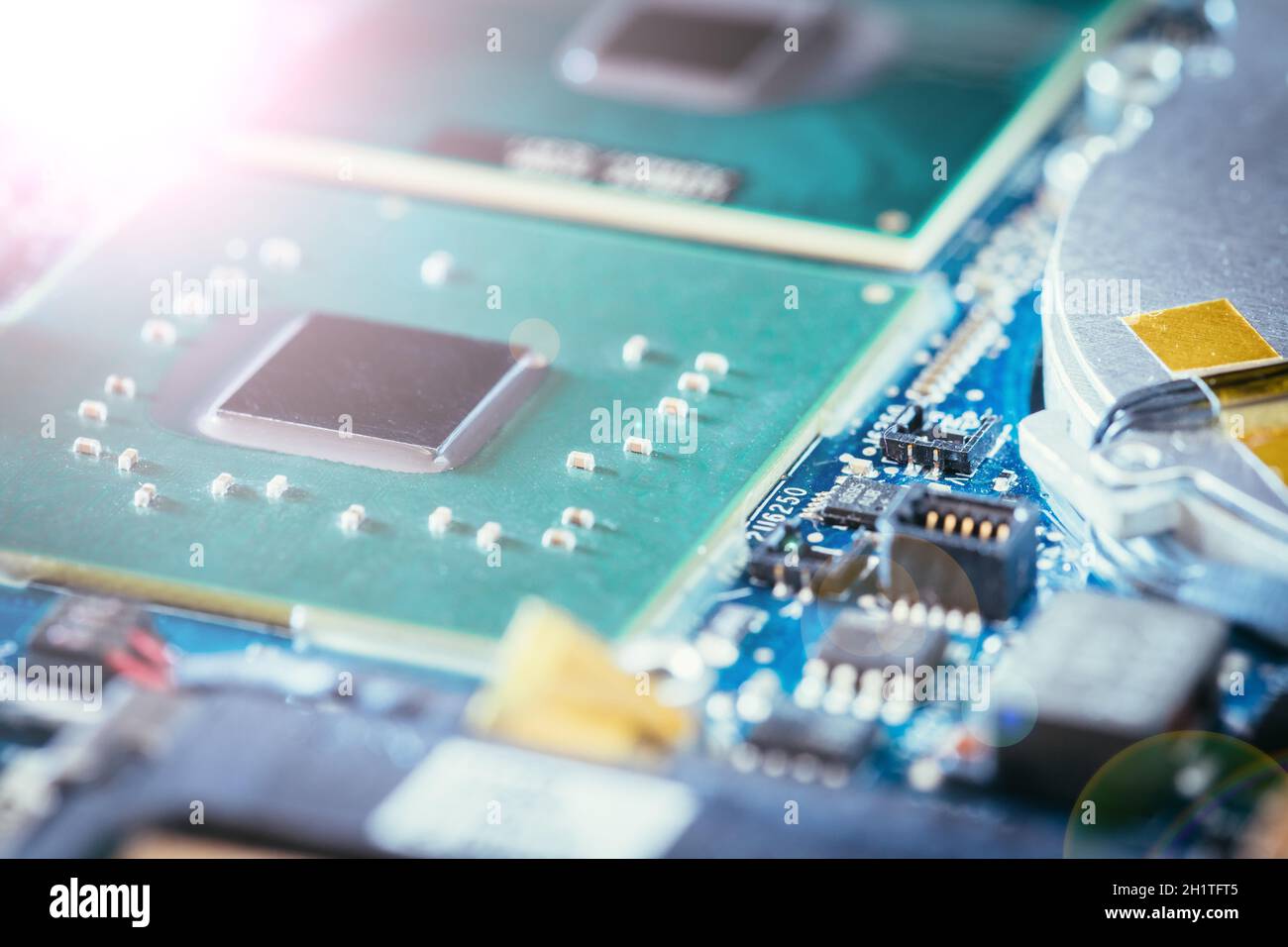 Computer chip on a circuit board, close up with light effect. Computer ...