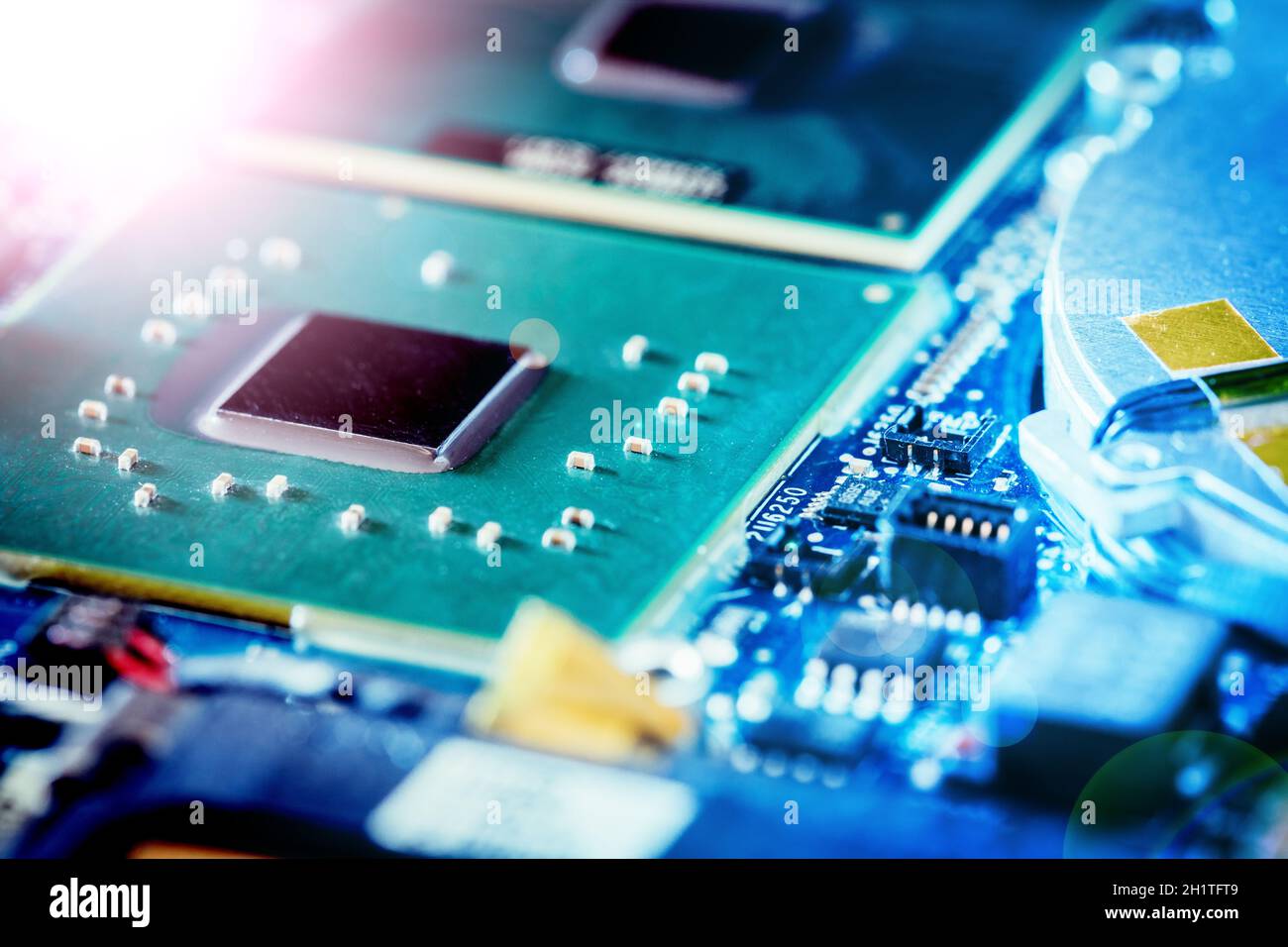 Computer chip on a circuit board, close up with light effect. Computer ...