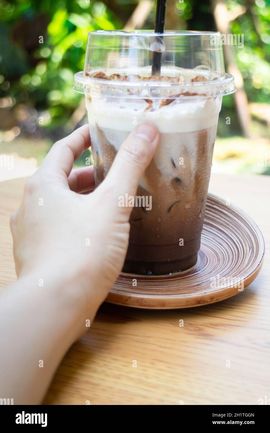 Female hand holding iced coffee hi-res stock photography and images - Alamy