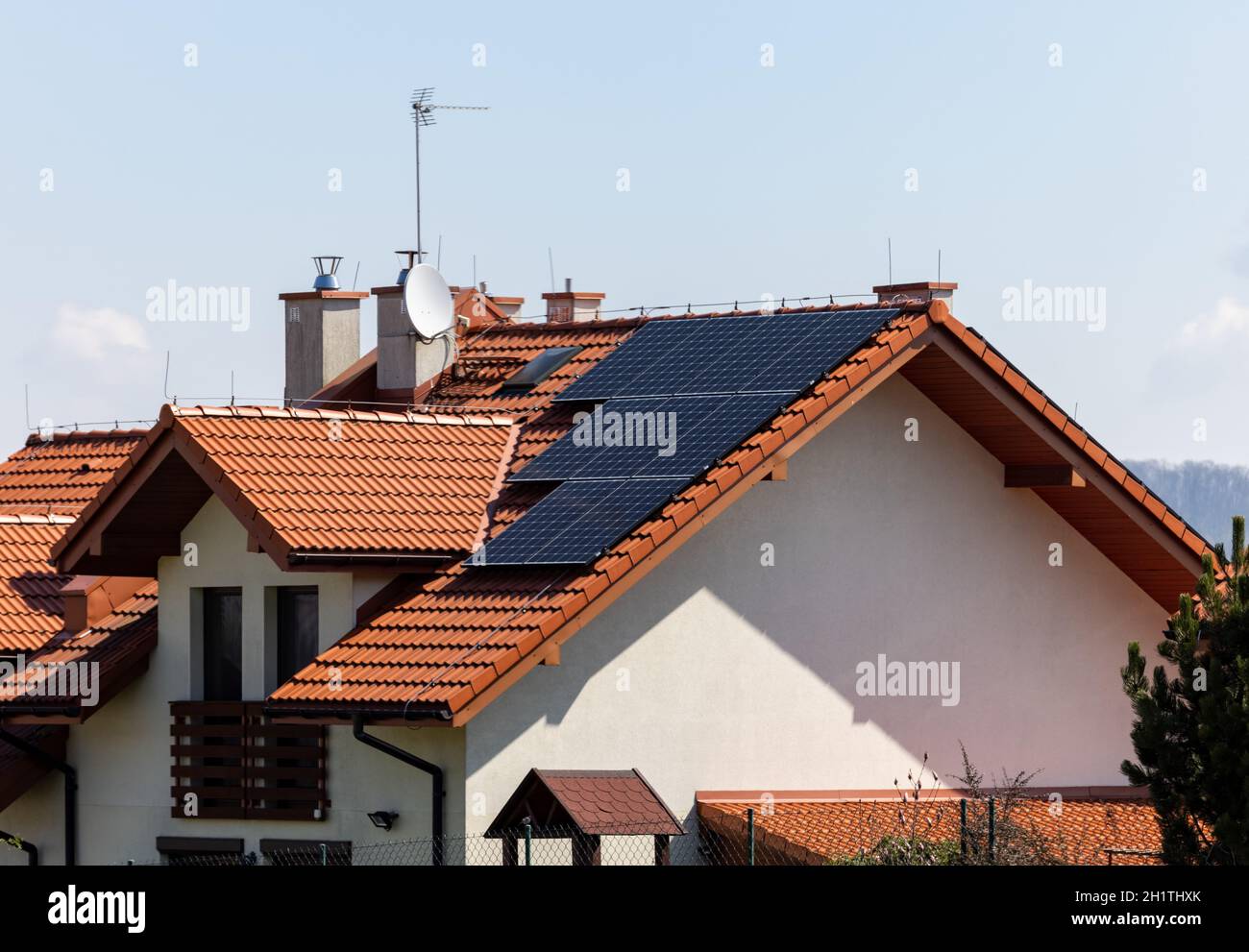 Solar electric panels on a house roof Stock Photo - Alamy
