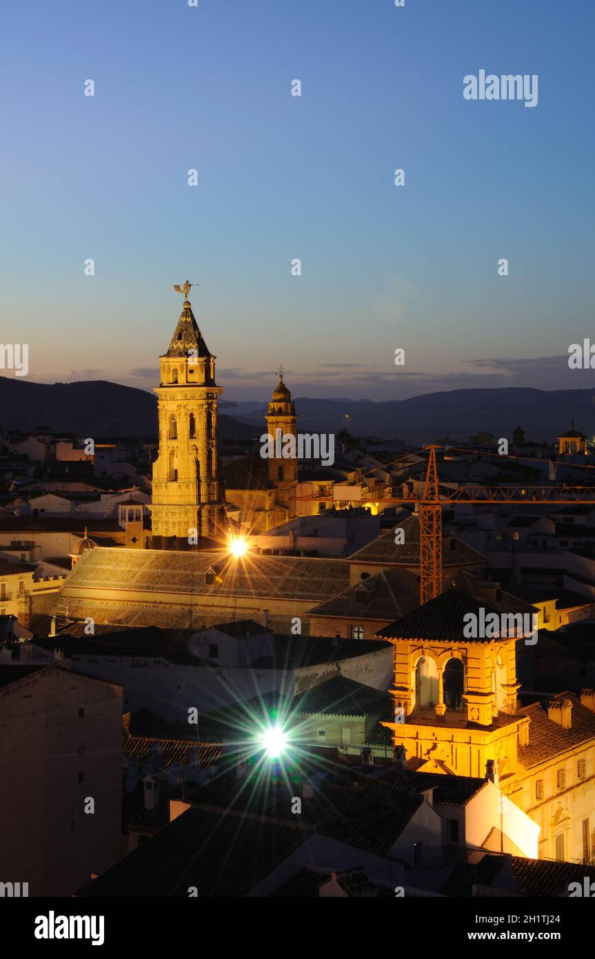 San Sebastian (nearest) and San Augustin church towers at dusk ...