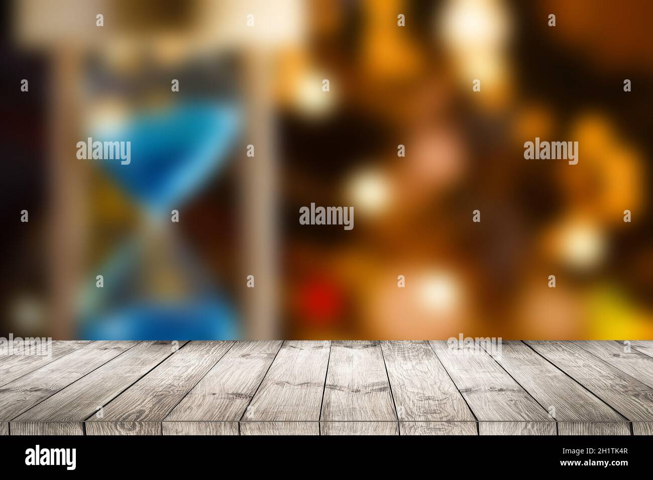 Bokeh background with empty wooden deck table for product montage ...
