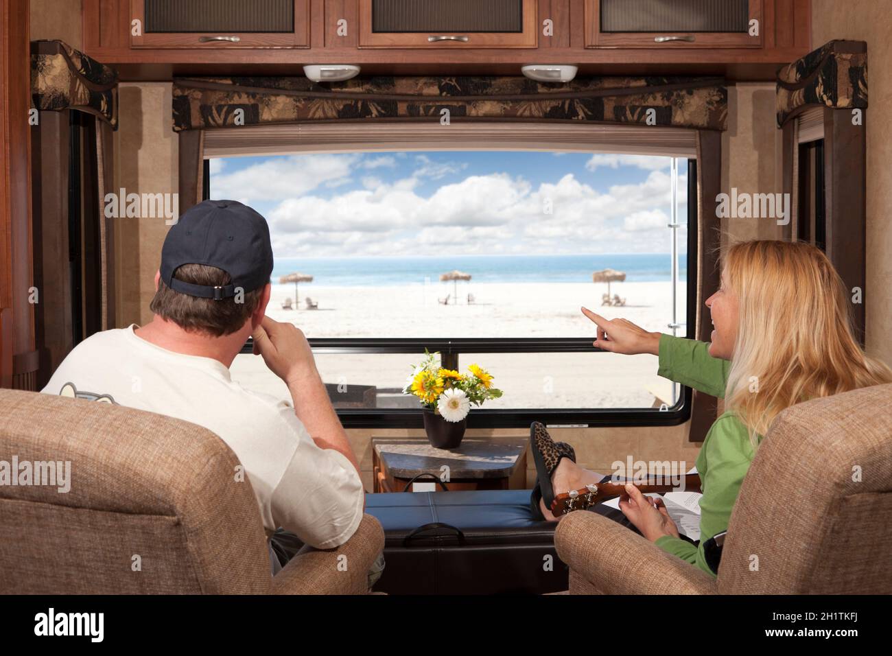 Young Couple Enjoying the Beach View From Their 5th Wheel RV Stock ...