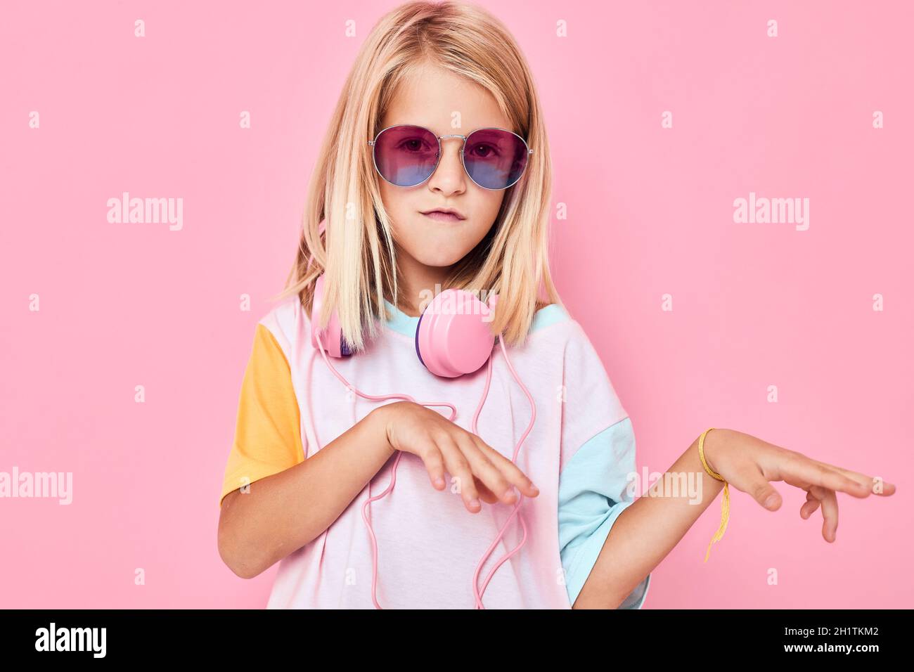 little girl blonde hair headphones fashion Stock Photo - Alamy