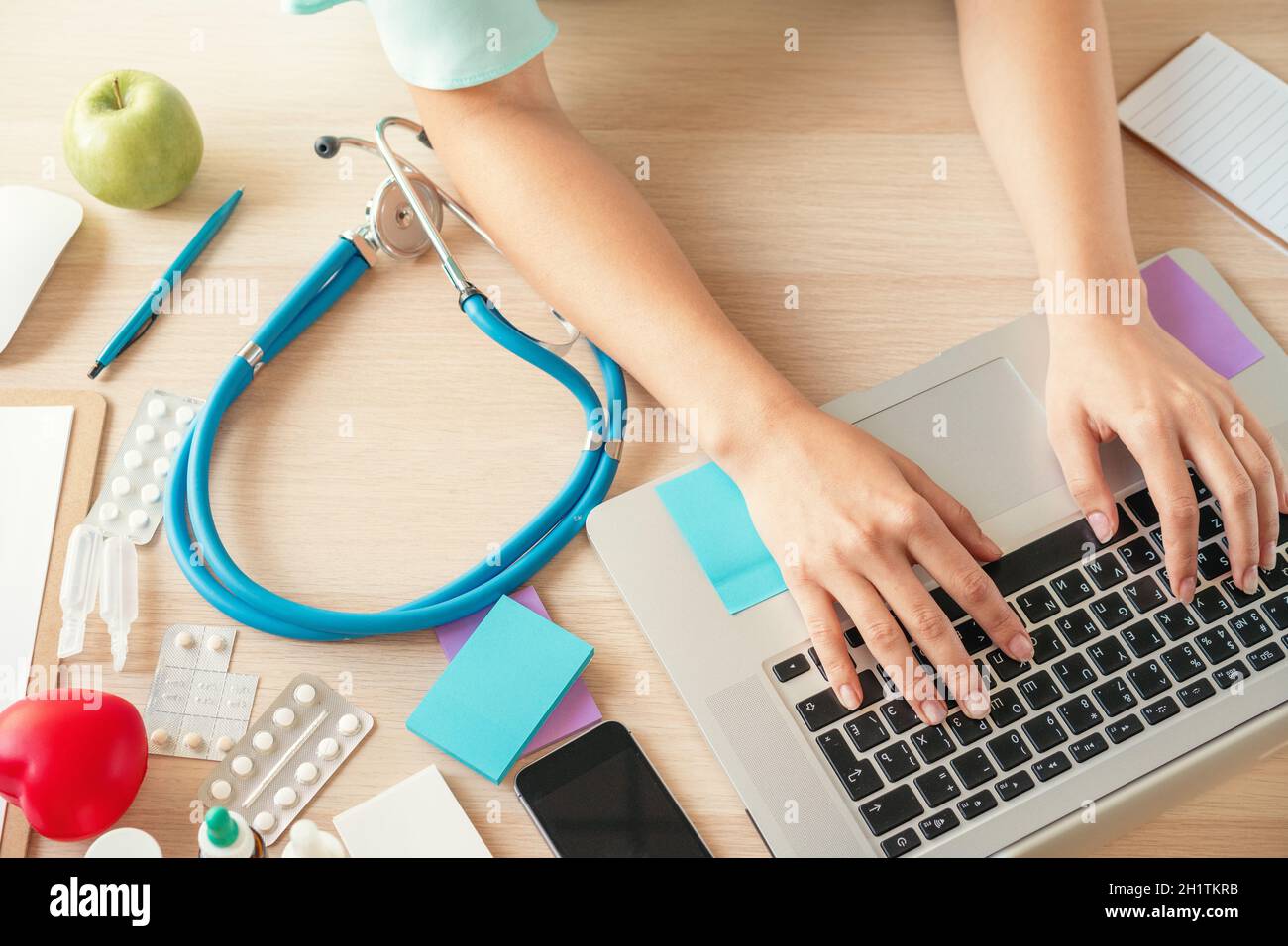 Female medicine doctor filling patient medical form or prescription ...