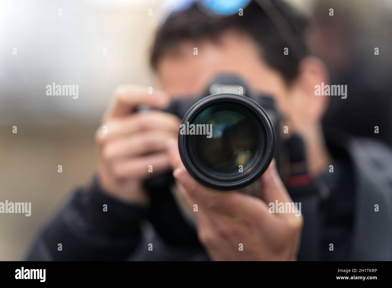 photographer reporter taking a photo, close up of the lens Stock Photo ...