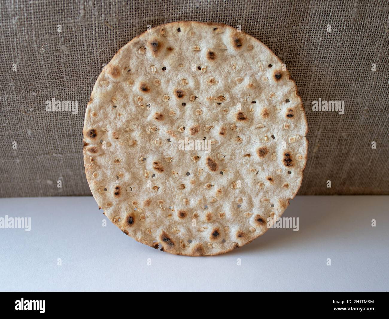 Thin round crispbread on white and textile background Stock Photo - Alamy