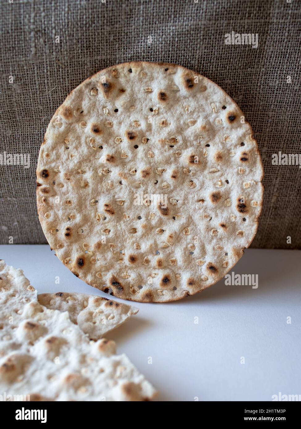 Thin round crispbread on white and textile background Stock Photo - Alamy