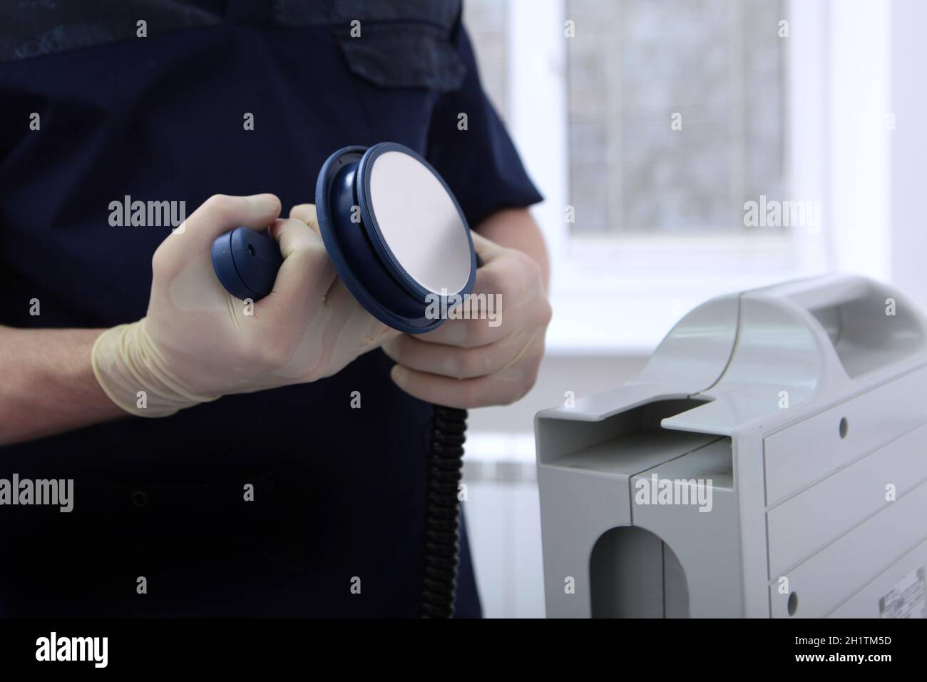 The resuscitator holds the defibrillation electrodes. Resuscitation of ...