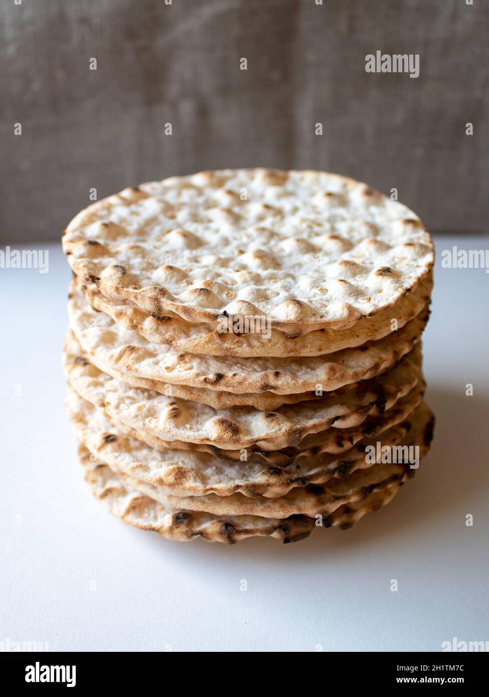Thin round crispbreads baked with wheat, rye and barley on white and ...