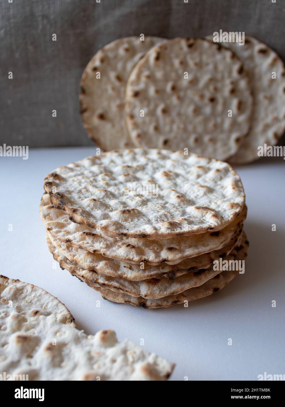 Thin round crispbreads baked with wheat, rye and barley on white and ...