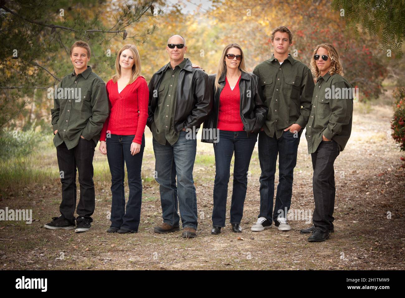 Happy Attractive Family Standing Portrait Outdoors Stock Photo - Alamy