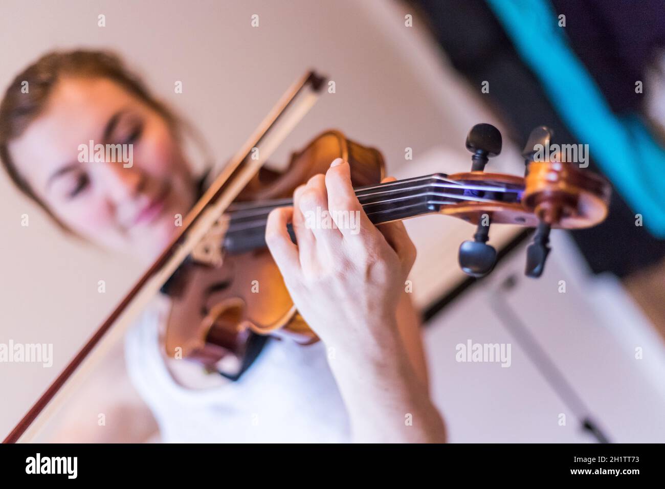 Pretty young girl practices on her violin, acoustic music Stock Photo ...