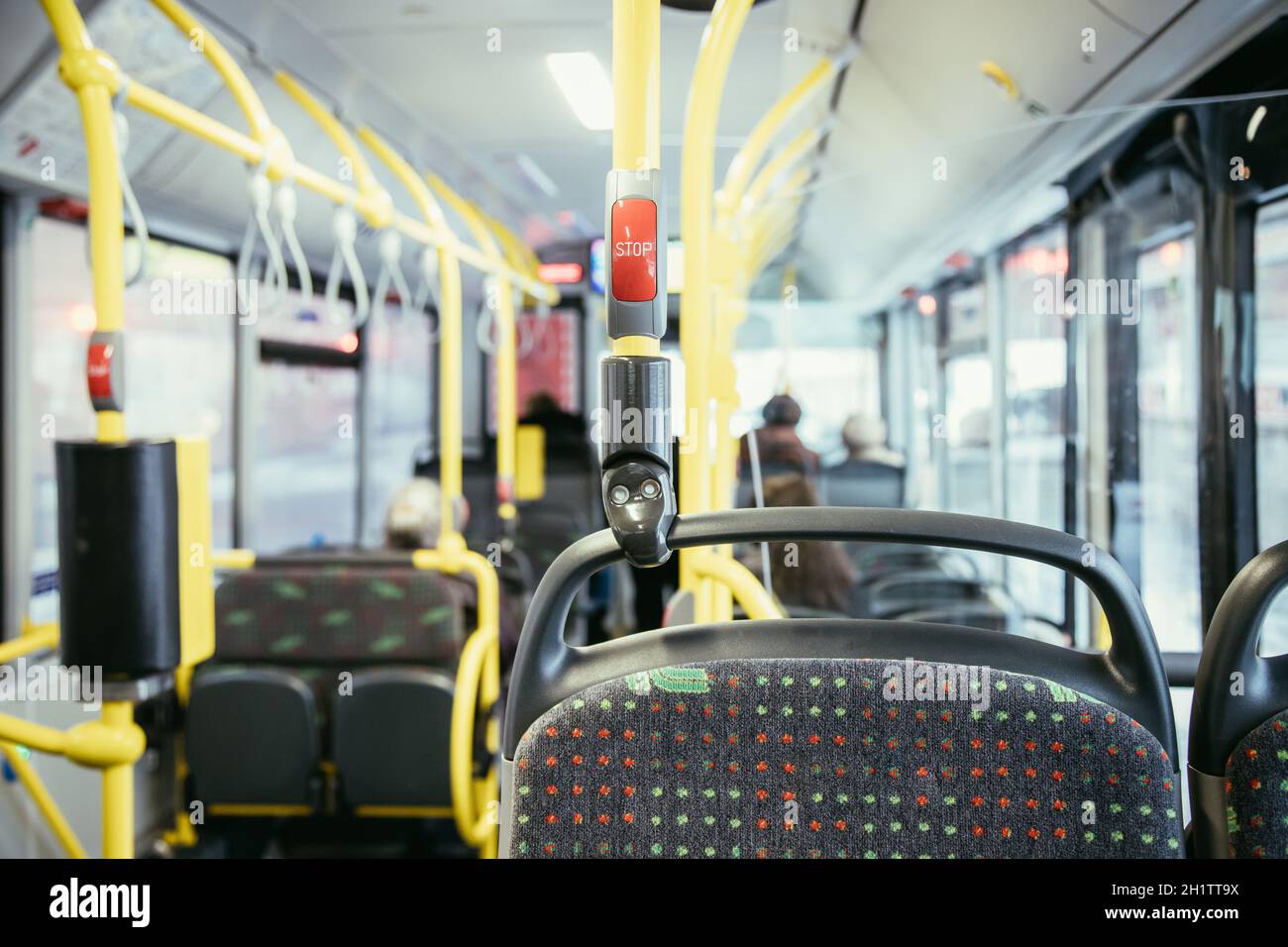 Stop Button in a bus, public transport, blurry Stock Photo - Alamy