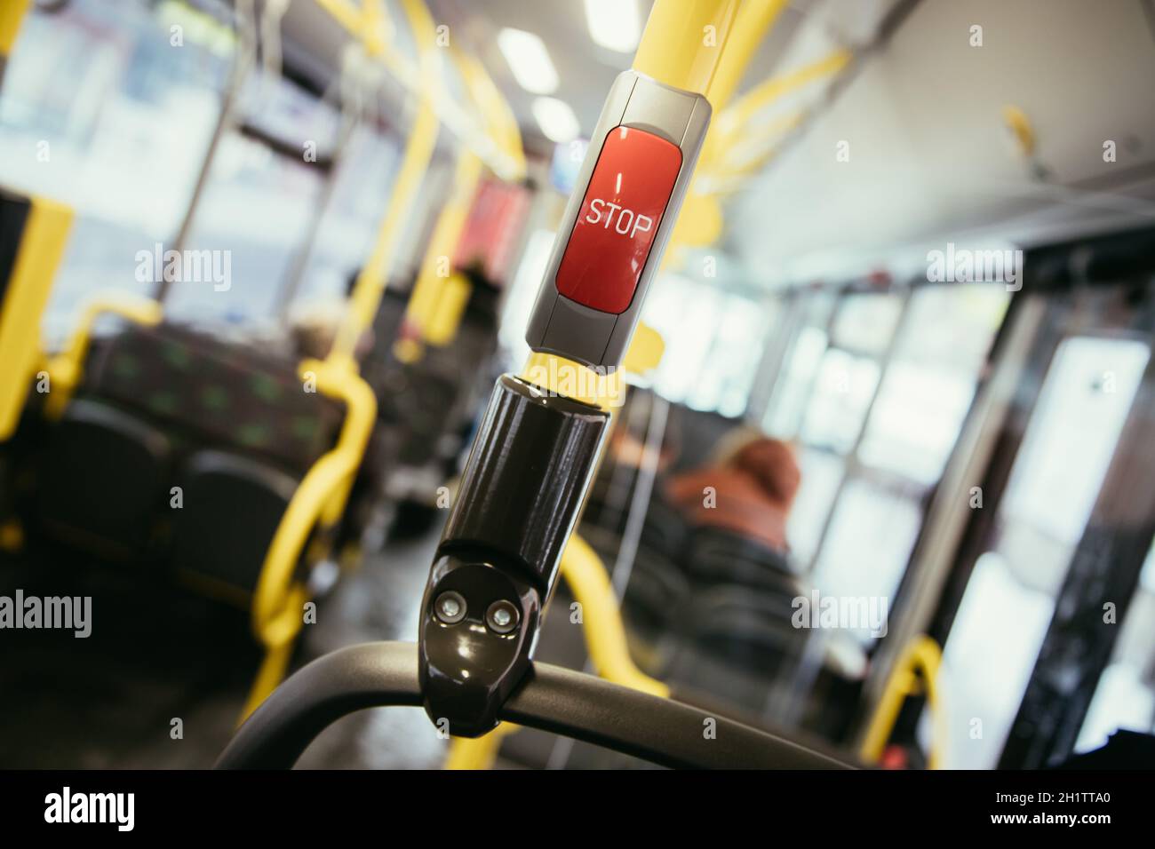 Stop Button in a bus, public transport, blurry Stock Photo - Alamy