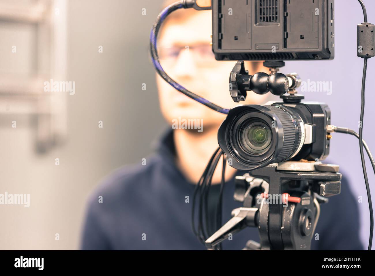 Film camera on a tripod in a television studio Stock Photo - Alamy