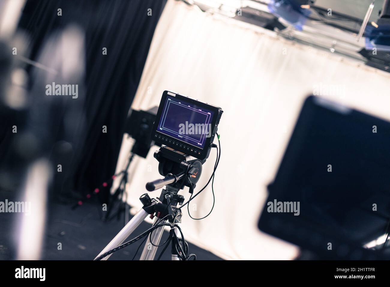 Film camera with lcd screen on a tripod in a television studio Stock ...