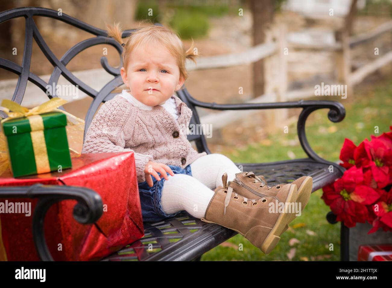Child sitting on bench hi-res stock photography and images - Alamy