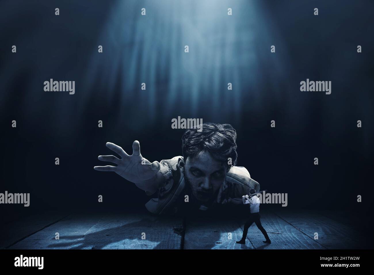 Asian man standing with a baseball bat in his hand ready to attack ...