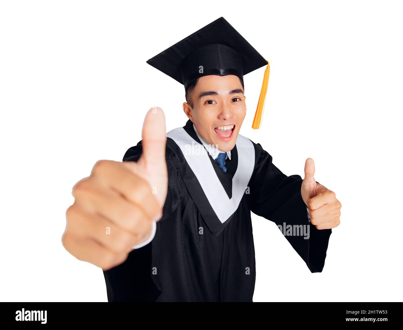 Excited young male graduation showing the thumbs up Stock Photo - Alamy